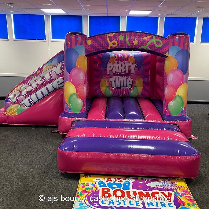 pink bouncy castle with slide for hire in Shropshire & Beyond